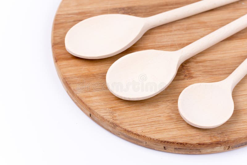 Three Wooden Spoons on a Kitchen Wooden Board Stock Photo - Image of ...