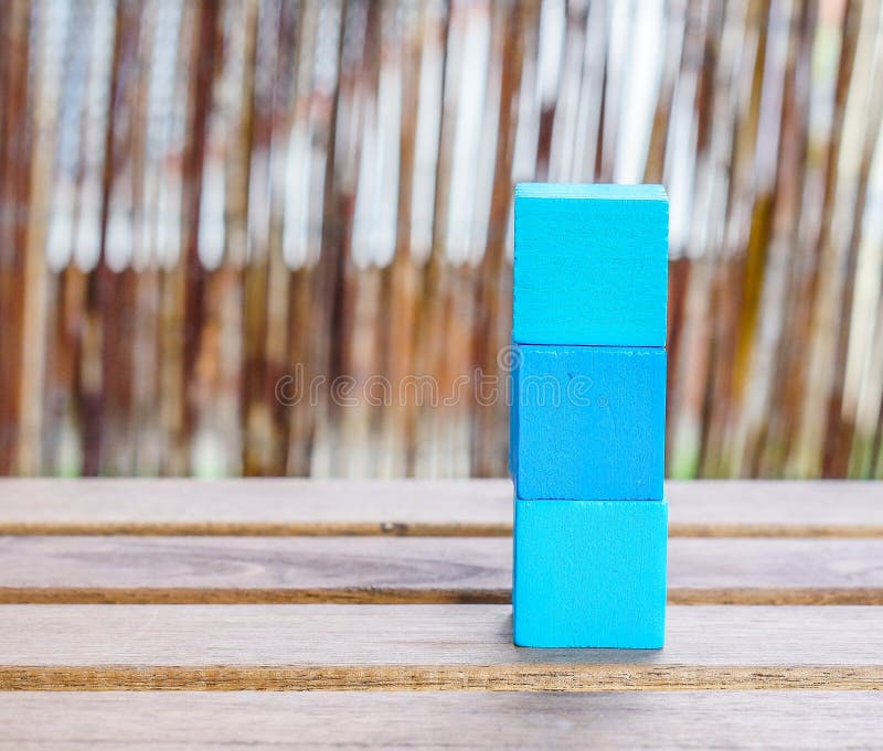 Three wooden toy blocks stock image. Image of wood, table - 79055325