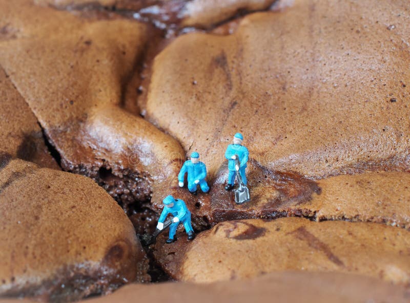 Three Workers are Digging into the Chocolate Cake. Stock Photo - Image ...