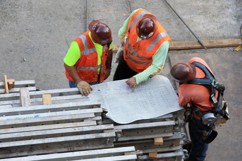 Three Workers with Drawing stock photo. Image of people - 6535568