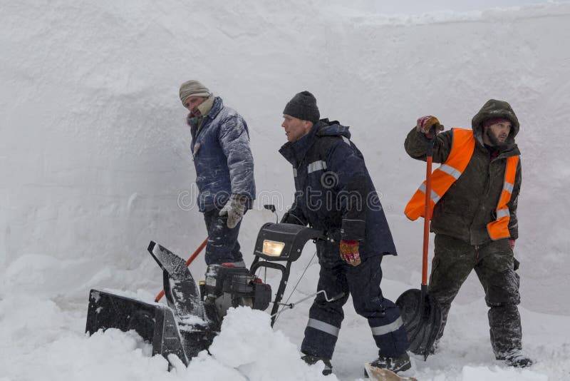 Three Workers in a Snowstorm during Snow Removal Stock Image - Image of ...
