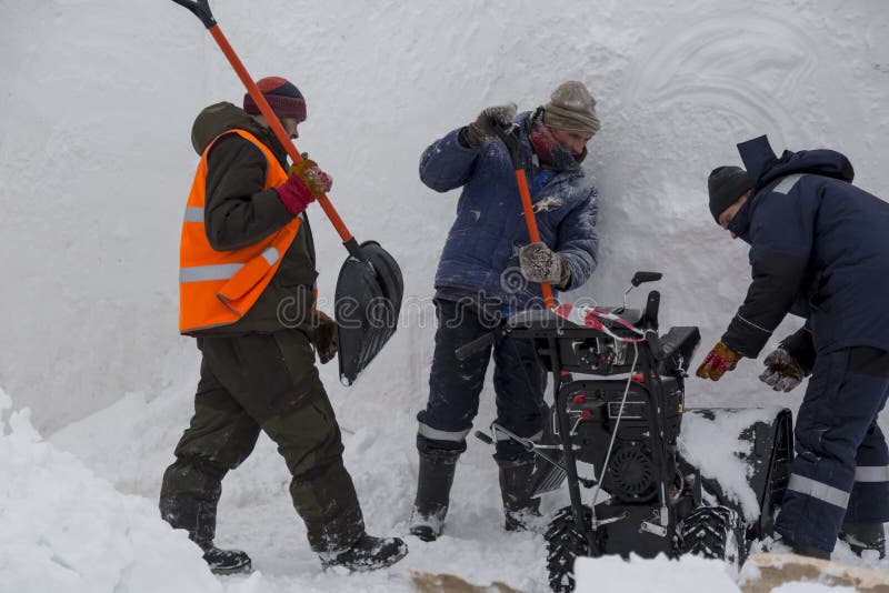 Three Workers in a Snowstorm during Snow Removal Stock Photo - Image of ...