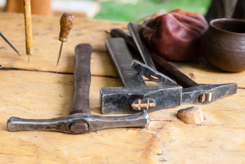 Three Working Tools an Old and Shabby Hammer and Pickaxe Lies on a ...