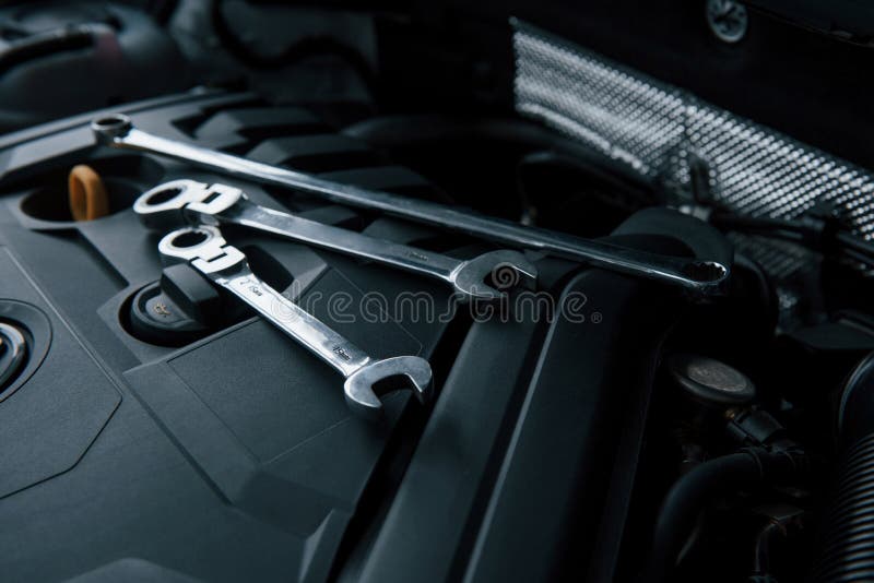 Three Wrenches. Repair Tools Lying Down on the Engine of Automobile ...