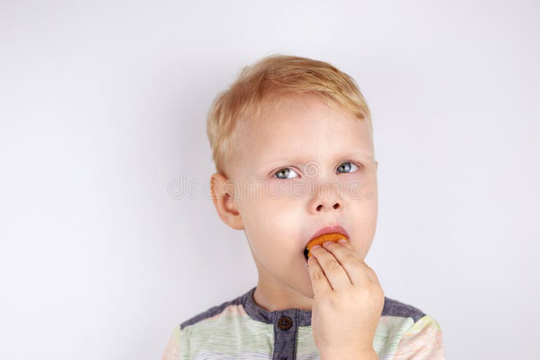 Three-year-old Boy Eats a Pie on a White Background Stock Photo - Image ...