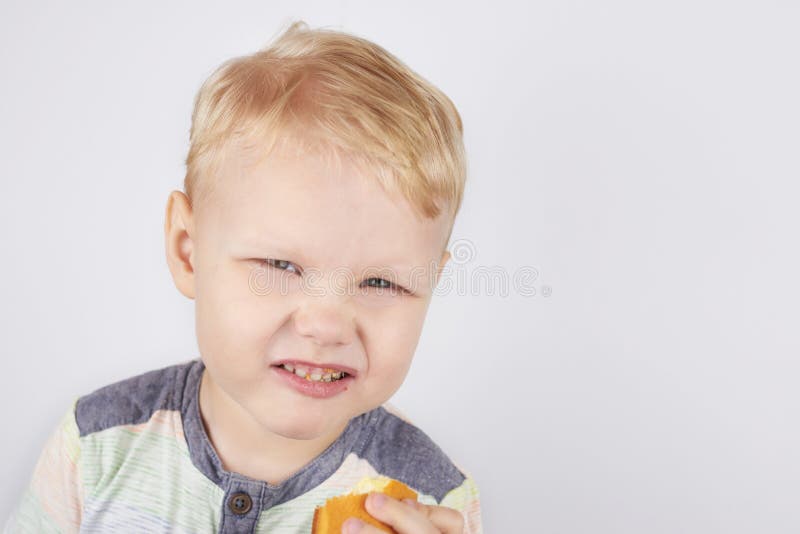Three-year-old Boy Eats a Pie on a White Background Stock Photo - Image ...