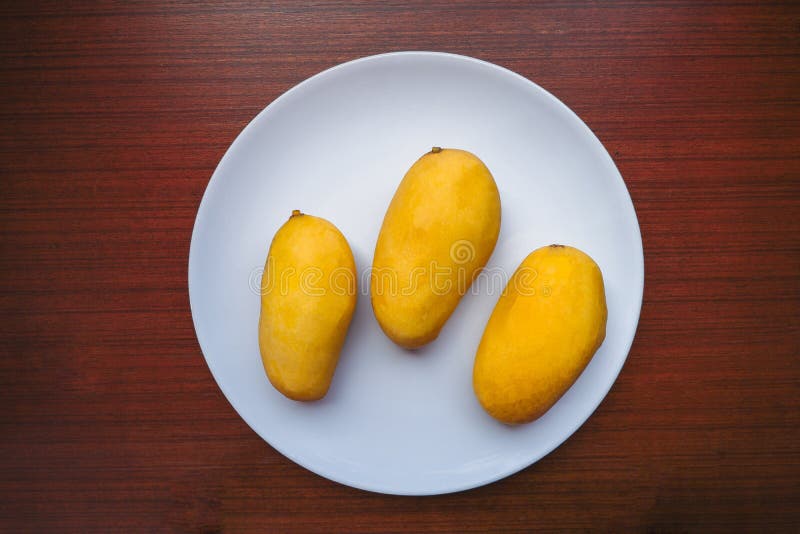 Three Yellow Mango that Served on the Plate Stock Photo - Image of ...