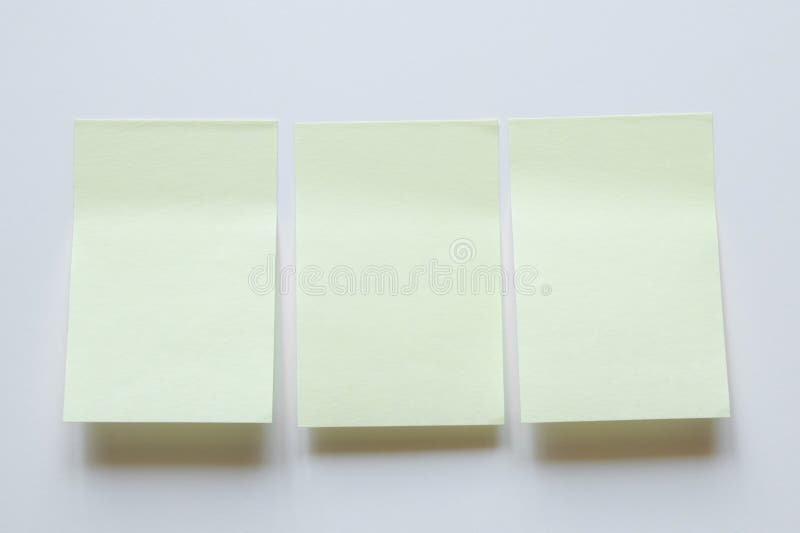 Three Yellow Sticky Note Papers with Adhesive Edge Attached To White ...