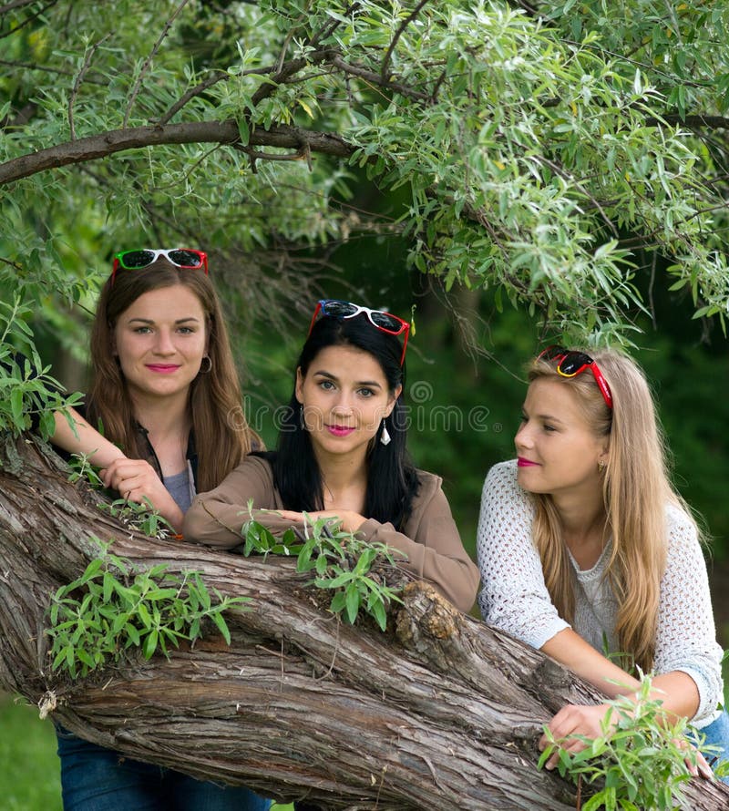 Three Young Beautiful Ladies Posing in the Park Stock Photo - Image of ...