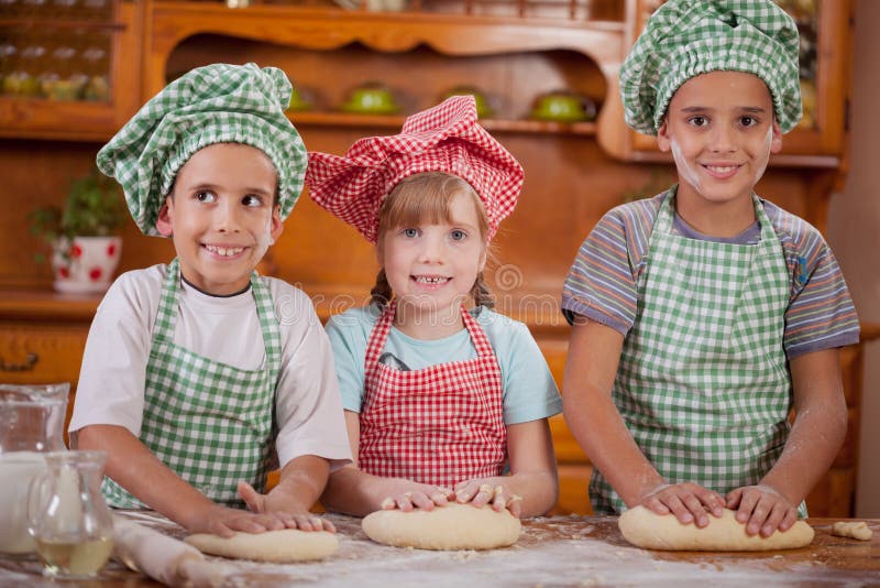 Three Young Children Make a Mess in the Kitchen Stock Photo - Image of ...