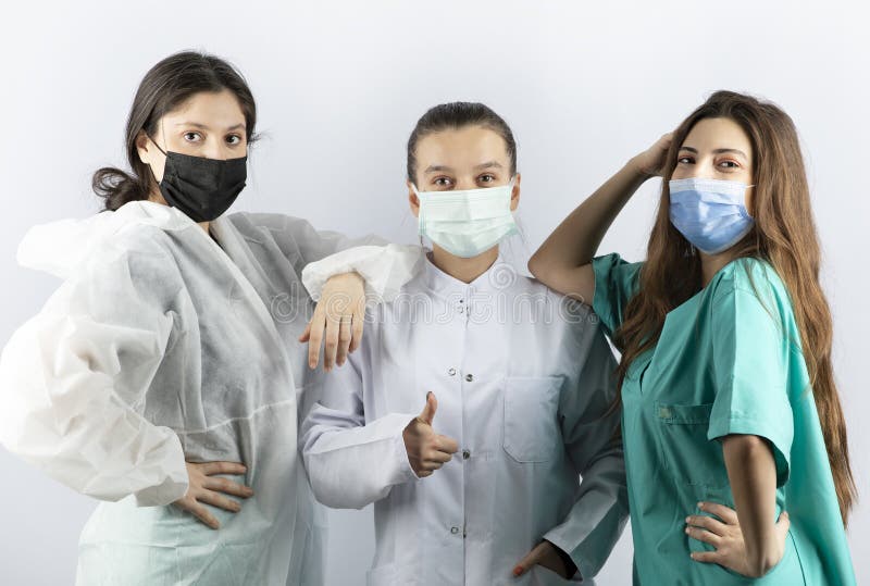 Three Young Female Doctors Standing and Looking at Camera Stock Photo ...
