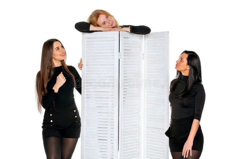 Three Young Female Friends Pose Together in the Studio Stock Image ...