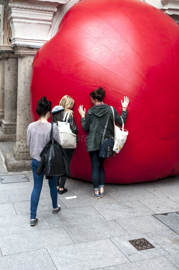 Three Young Ladies Interact with a Giant Red Ball Editorial Image ...