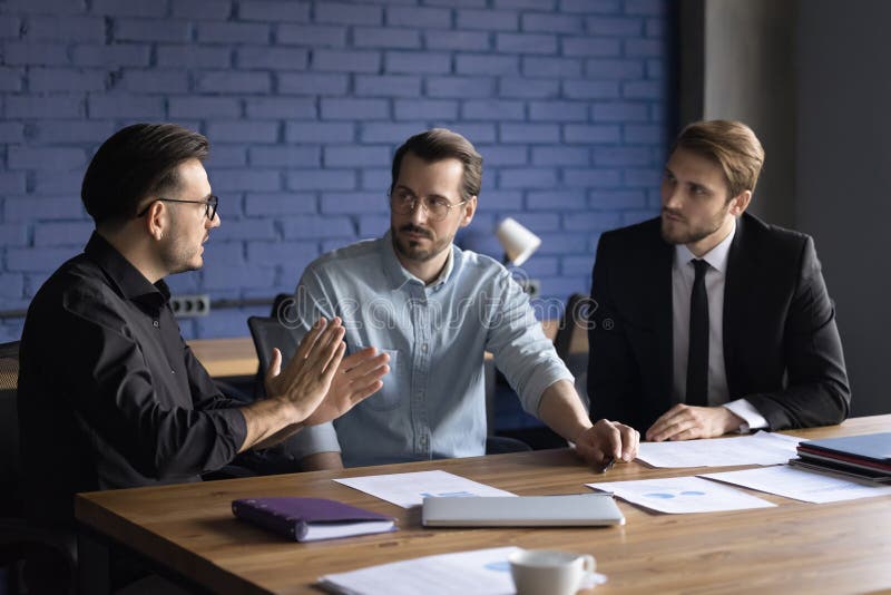 Three Young Male Colleagues Work Together in Office Stock Image - Image ...