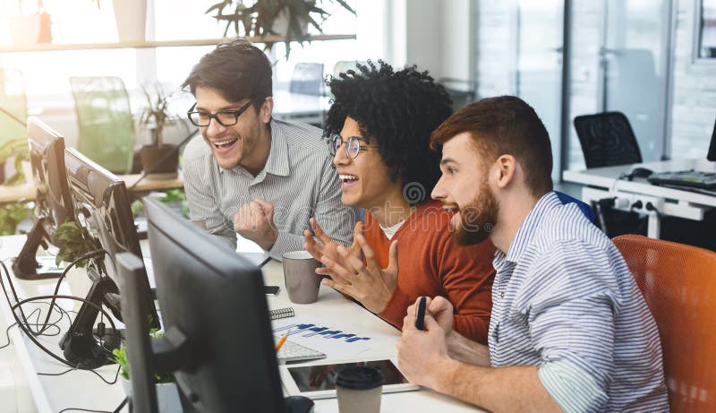 Three Young Men Enjoying Good Coding Job on Computer Stock Photo ...