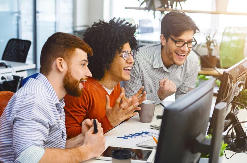 Three Young Men Enjoying Good Coding Job on Computer Stock Photo ...