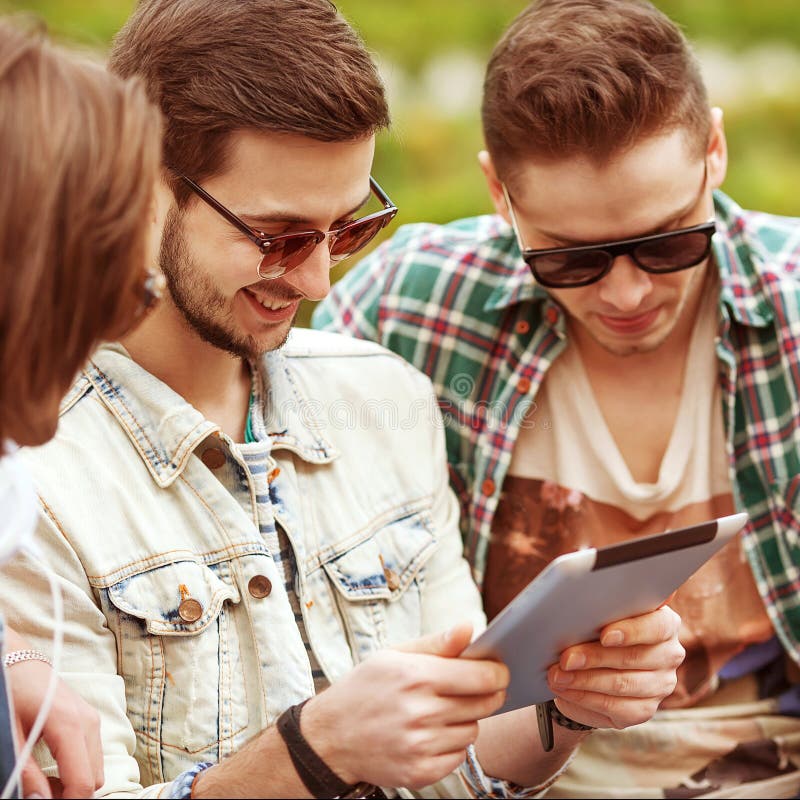 Three Young Men Friends Using Tablet Stock Photo - Image of city ...