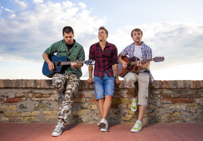 Three Young Men Music Band Playing Outdoors Sunny Stock Image - Image ...