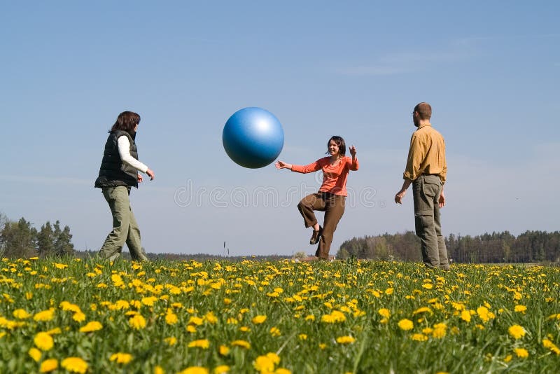Three Young People with Ball Stock Photo - Image of yellow, balls: 2420808