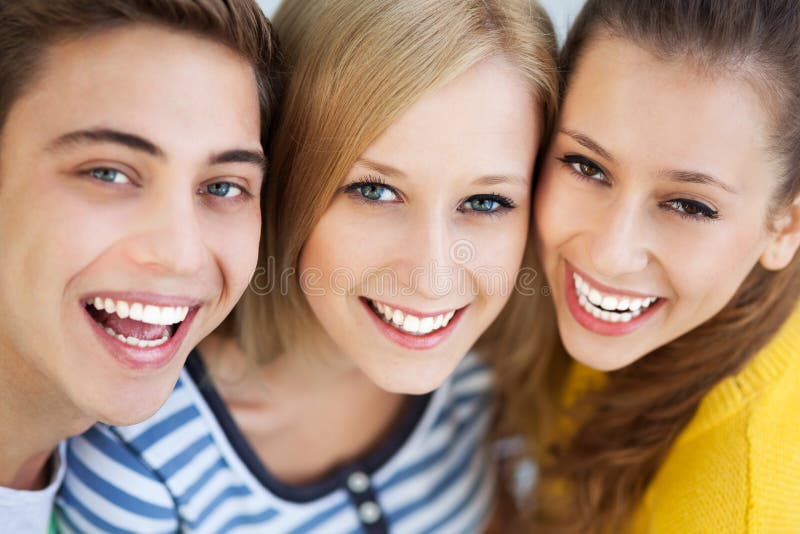 Three young people smiling stock image. Image of boys - 26829691