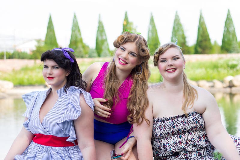 Three Young Plus Size Model Sitting by the Lake Stock Photo - Image of ...