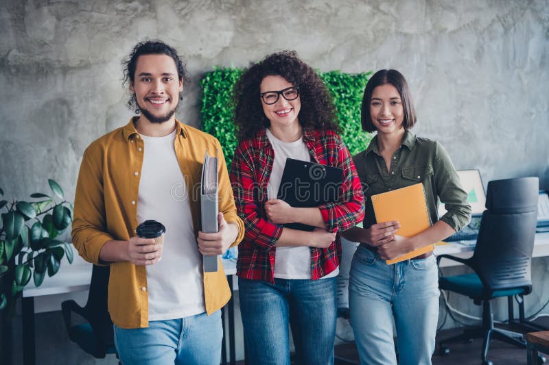 Friendly Group of Diverse Young Professionals Collaborating in a Modern ...