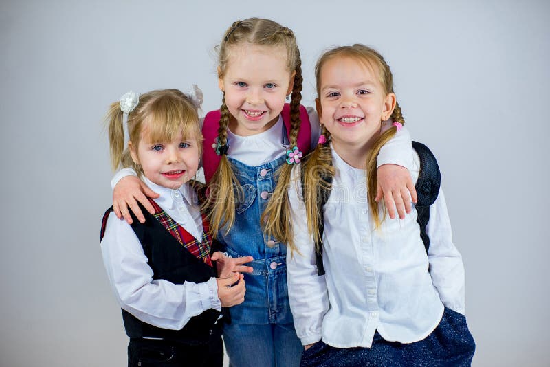 Three Young Schoolgirls Sitting at the Table Stock Photo - Image of ...