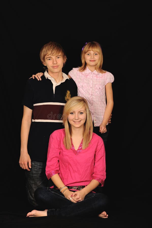 Three young siblings stock image. Image of smile, females - 13708707