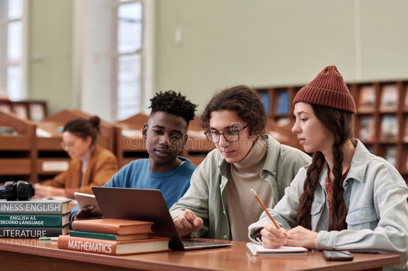 Three Young Students Using Laptop Stock Image - Image of group ...
