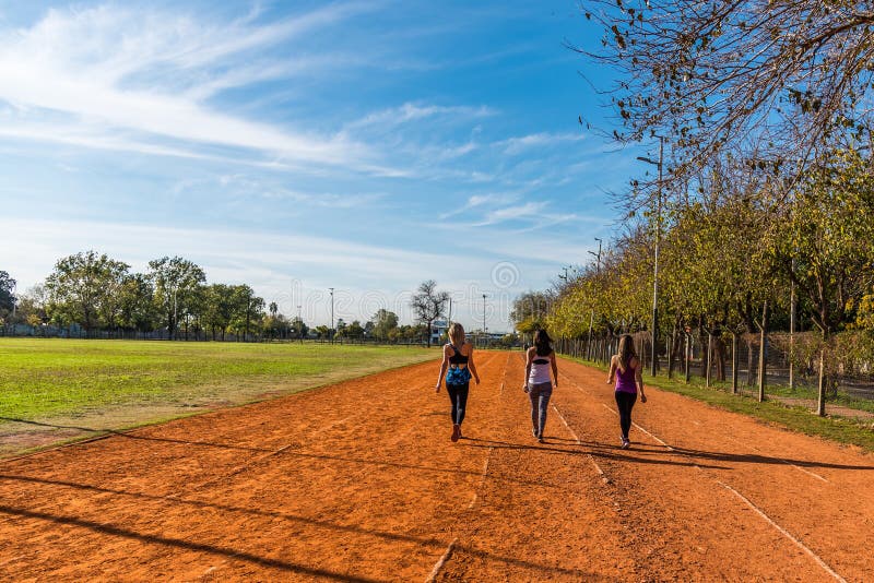 Three Young Women Running on the Running Track Stock Photo - Image of ...