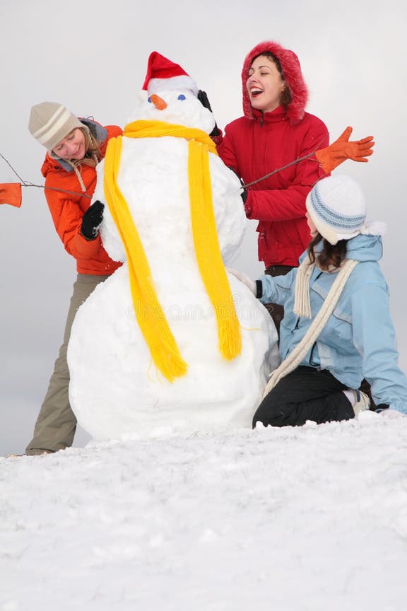 Three Young Women and Snowman Stock Photo - Image of happiness, cloth ...