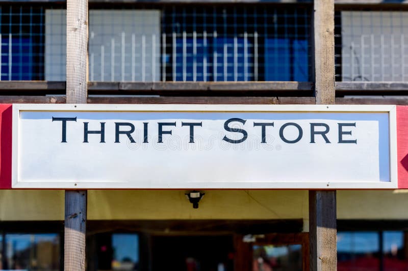Thrift Store Sign with Classic Typography Above Wooden Storefront Imagen de archivo - Imagen de ...