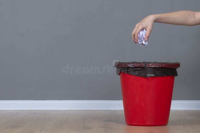 Throw Crumpled Paper in a Red Trash Can Stock Photo - Image of ...