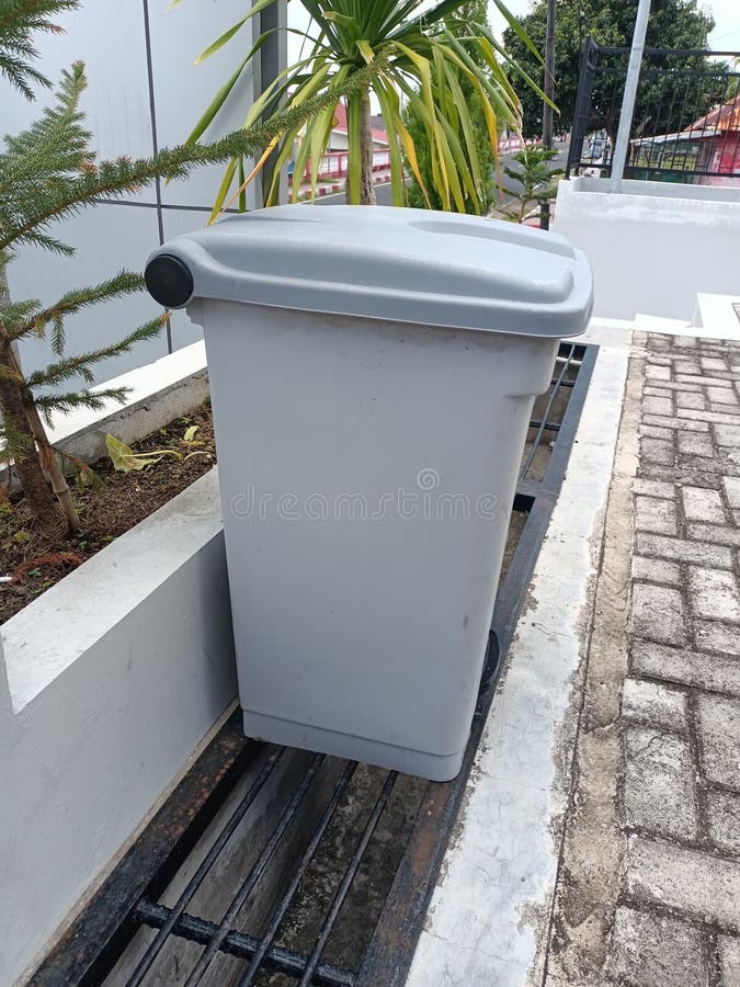 Throw garbage in its place stock photo. Image of house - 269625166