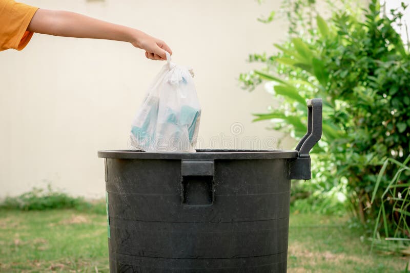 Throw Trash in Plastic Bags into the Trash in the Garden Stock Image ...