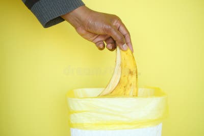 Throwing Banana in a Garbage Bin Stock Photo - Image of banana ...