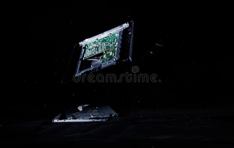 Throwing and Breaking a Screen into Pieces Isolated on a Black Backdrop ...