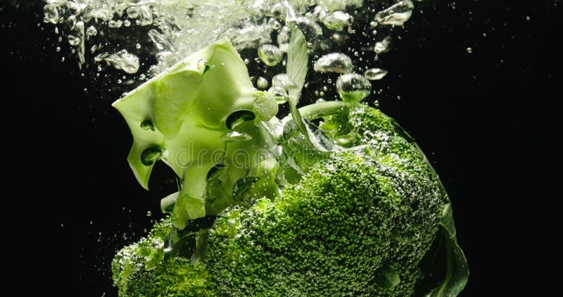 Throwing Broccoli into Water. Cooking in the Kitchen Stock Footage ...