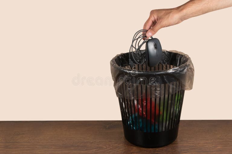 Throwing a Computer Mouse in the Trash Bin, a Computer Mouse in Hand in ...