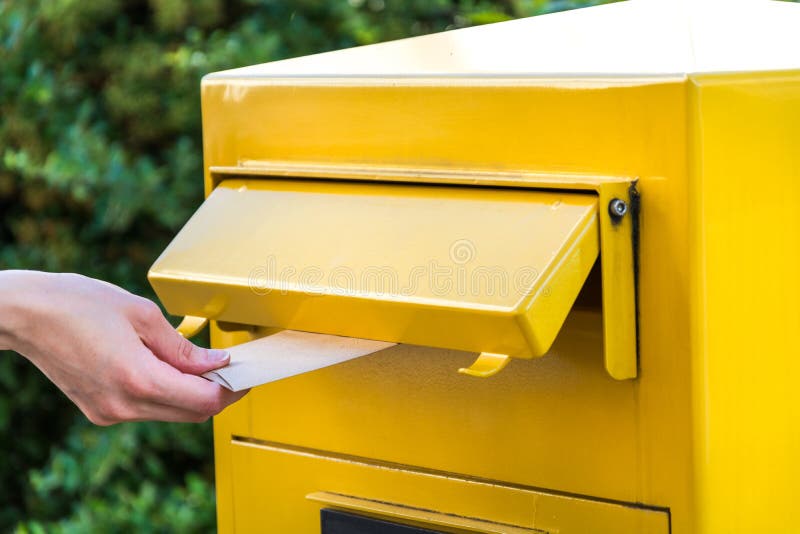 Throwing a Letter in a Yellow Mailbox Stock Image - Image of mail, hand ...