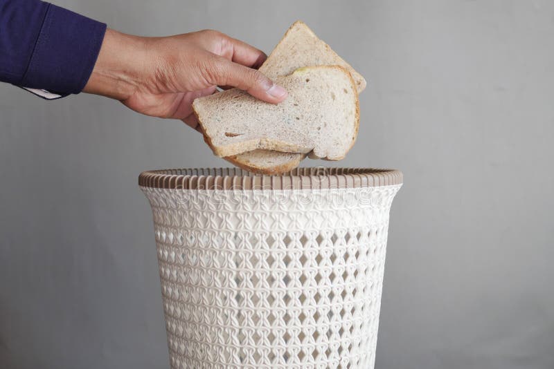 Throwing Old Bread in a Garbage Bin Stock Photo - Image of reusing ...