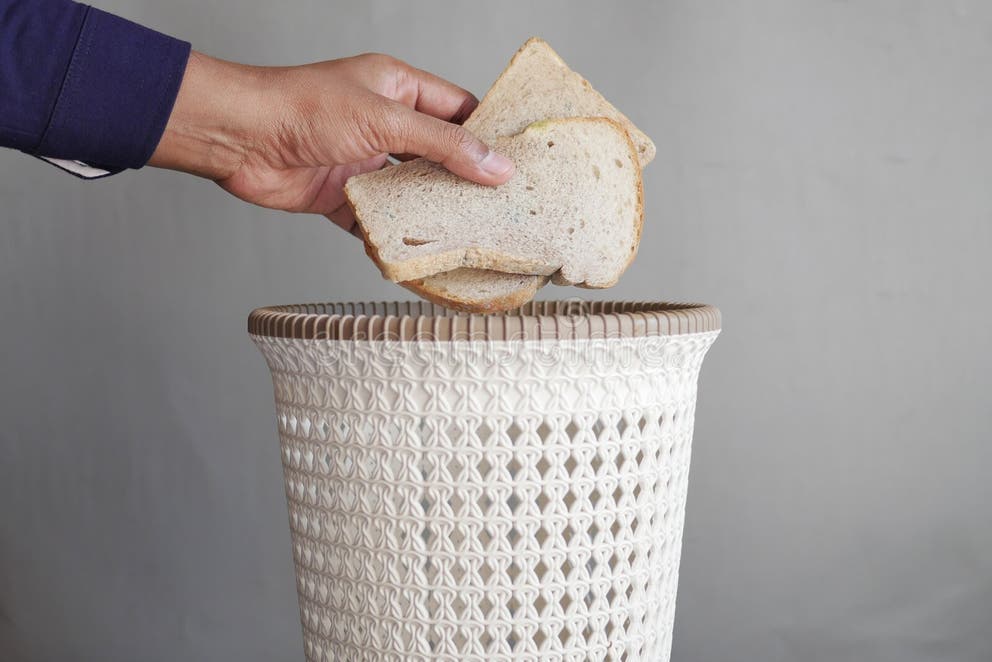 Throwing Old Bread in a Garbage Bin Stock Photo - Image of reusing ...
