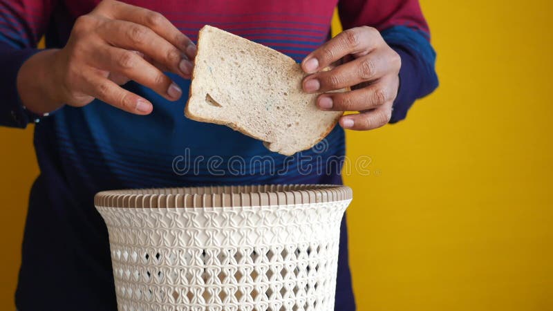 Throwing Old Bread in a Garbage Bin Stock Video - Video of disposal ...