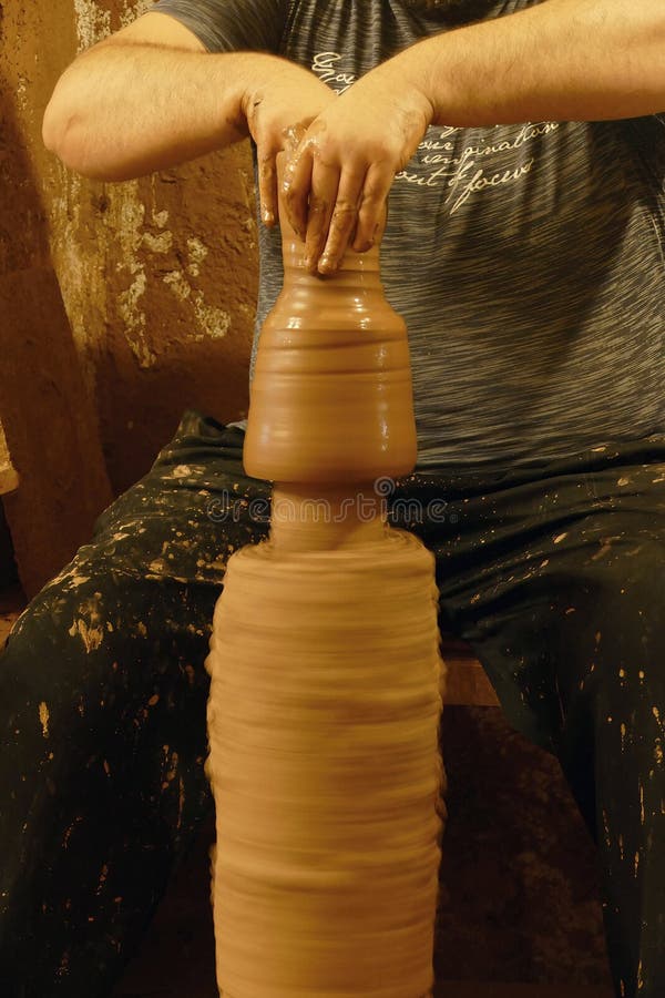 Throwing pots on a wheel stock photo. Image of pots - 260080550