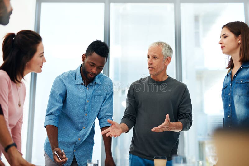 Throwing Some Ideas Around. a Group of Architects Discussing Business in the Boardroom. Stock ...