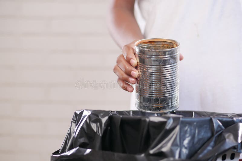 Throwing Tin Container in a Garbage Bin Stock Photo - Image of ...