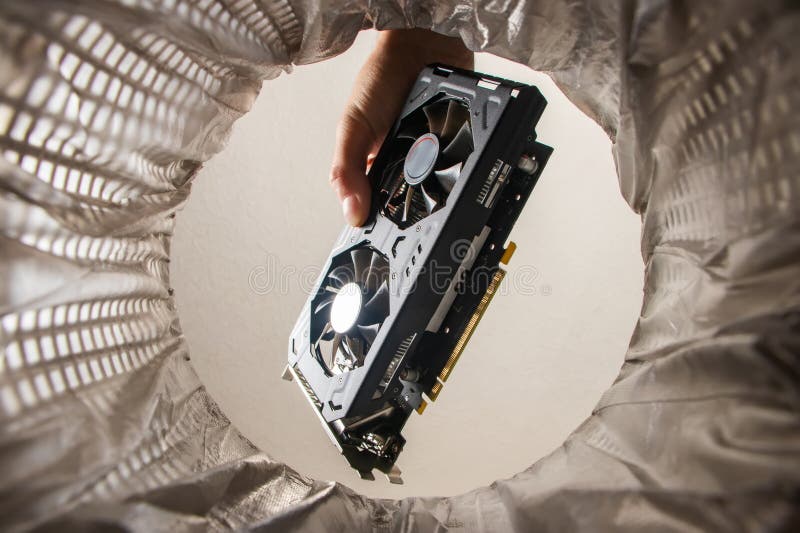Throwing a Video Card in the Trash Bin, a Computer Video Card in Hand ...
