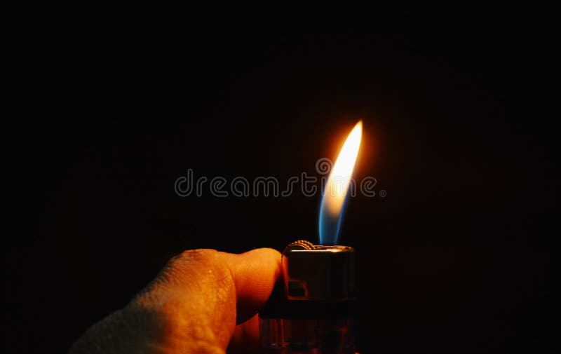 Thumb Lighting Plastic Lighter in Dark Stock Photo - Image of heat ...
