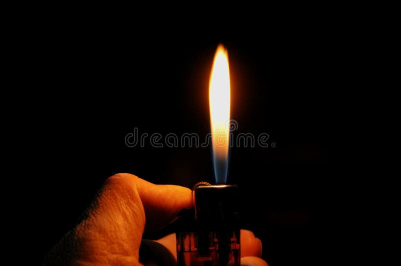Thumb Lighting Plastic Lighter in the Dark Stock Photo - Image of home ...