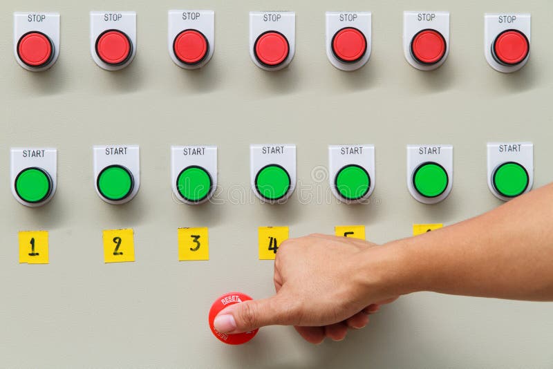Thumb Touch on Red Emergency Stop Switch and Green Start Button Stock ...